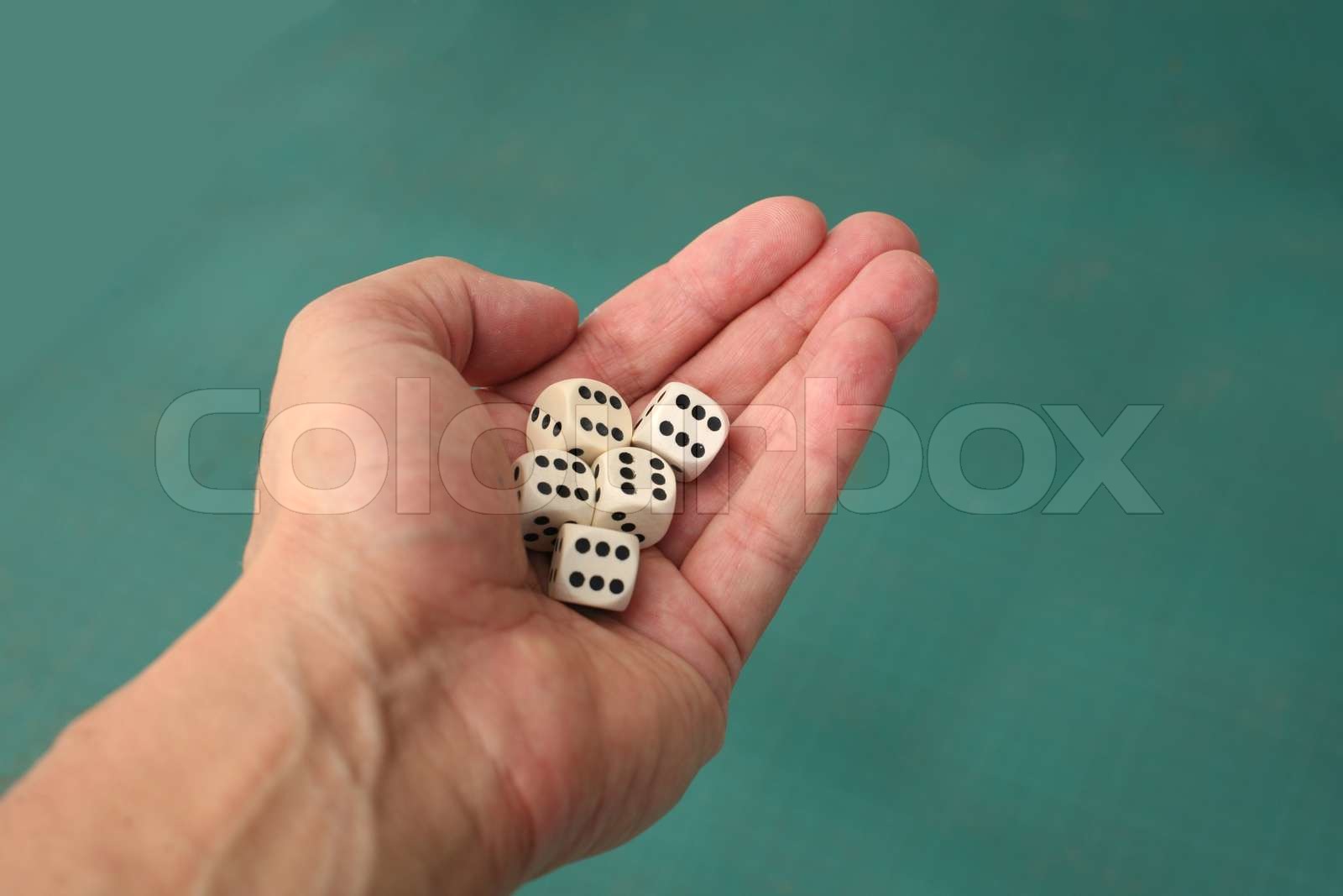 hands and dices | Stock image | Colourbox