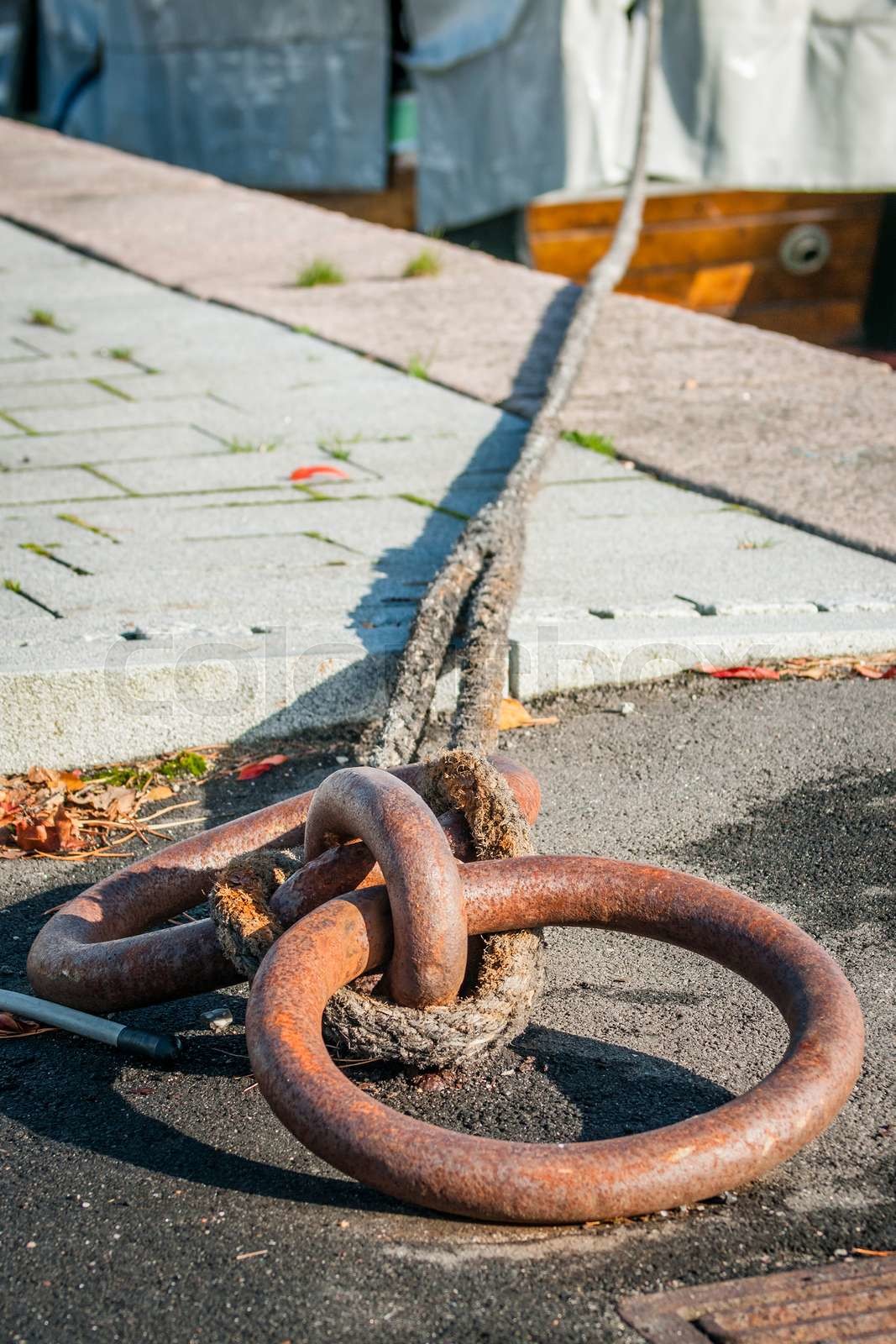 Ship anchored to a post | Stock image | Colourbox