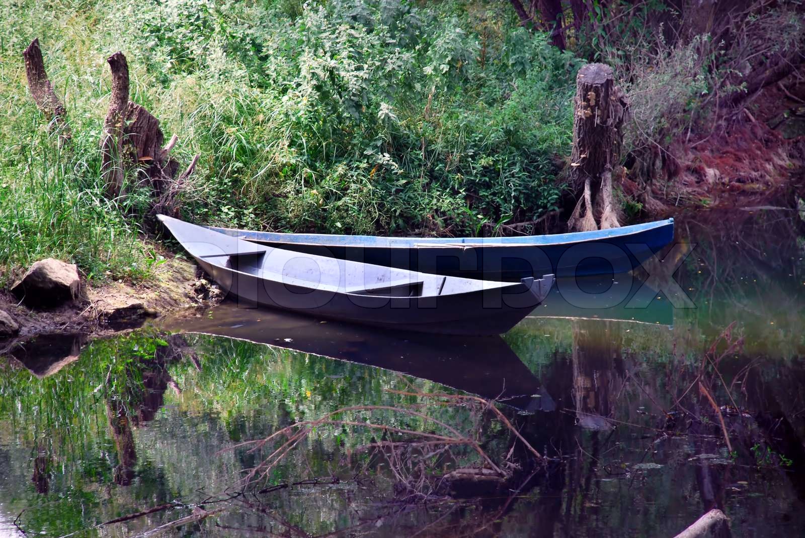 two small boats over tranquil river landscape | Stock image | Colourbox