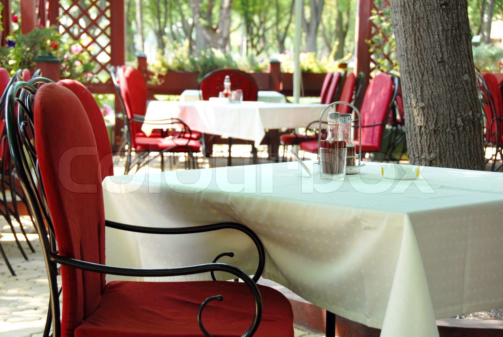 restaurant terrace with metallic chairs and tables outdoor | Stock ...