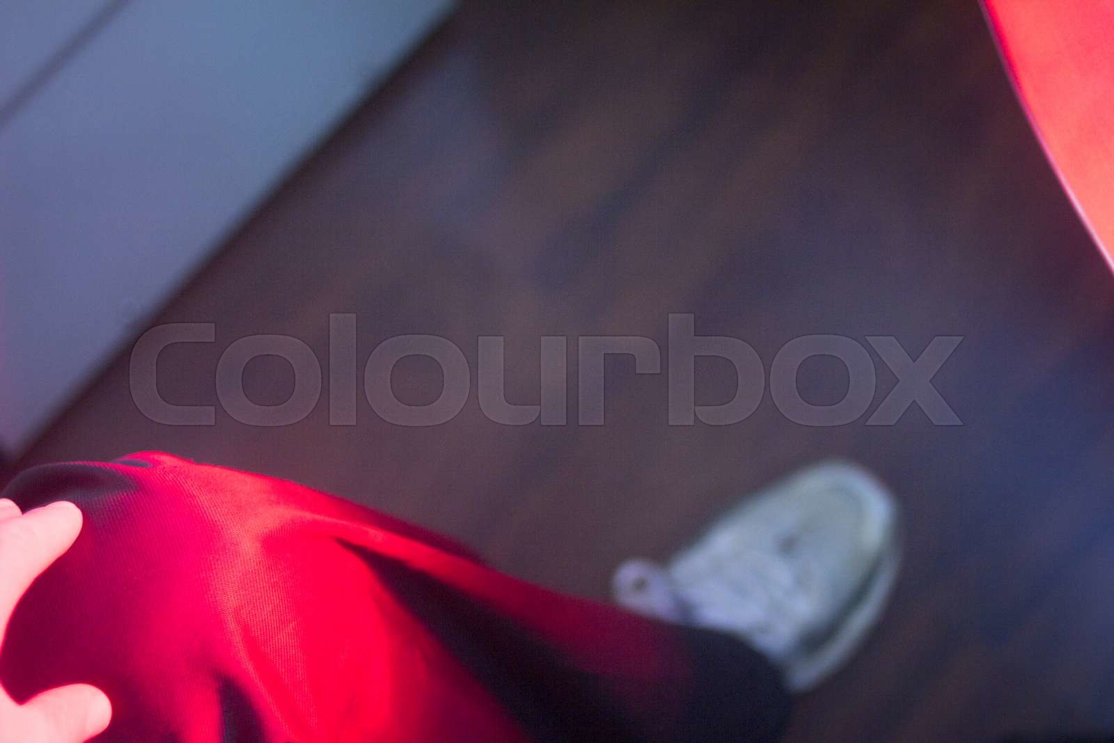 Patient leg in red physiotherapy heat treatment | Stock image | Colourbox