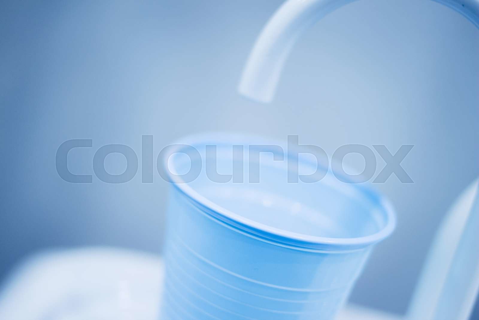 Dentist water rinse cup tap filler in dental clinic | Stock image ...