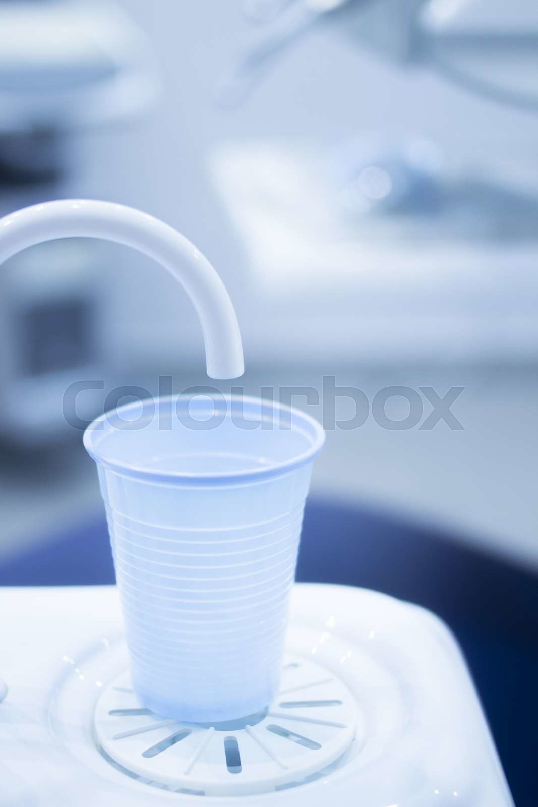 Dentist water rinse cup tap filler in dental clinic | Stock image ...