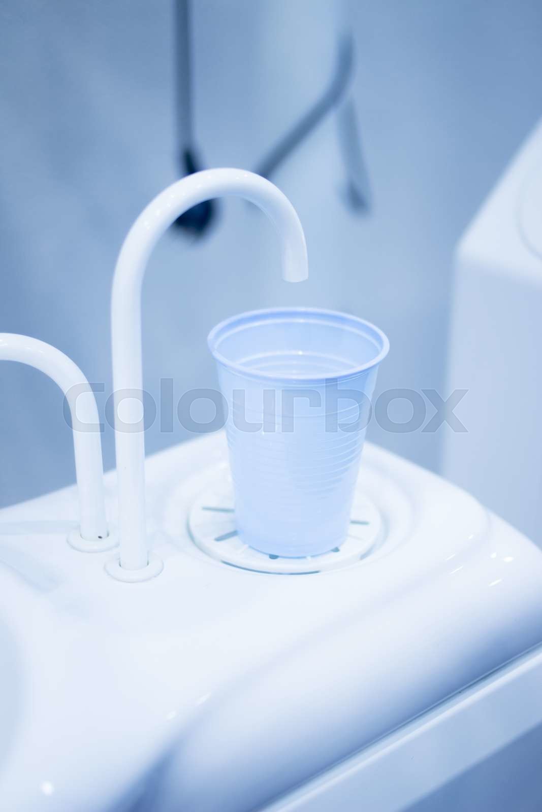 Dentist water rinse cup tap filler in dental clinic | Stock image ...