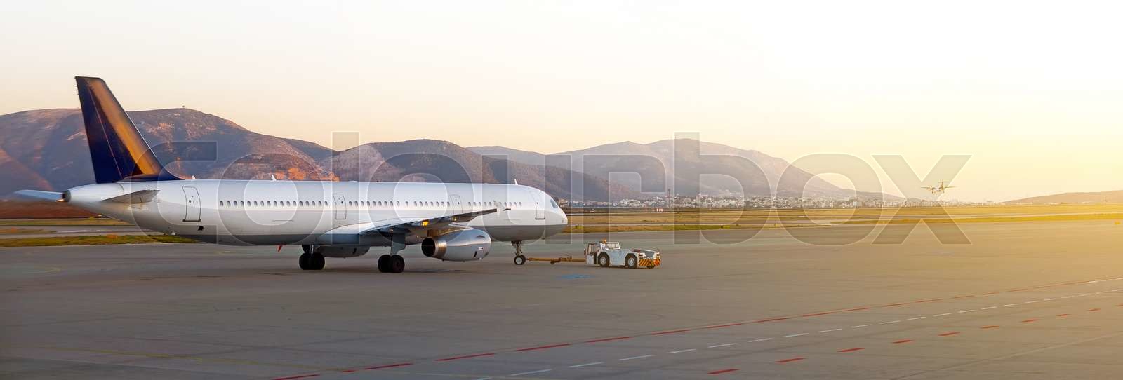 TUG Pushback tractor with Aircraft on the runway in airport. | Stock ...