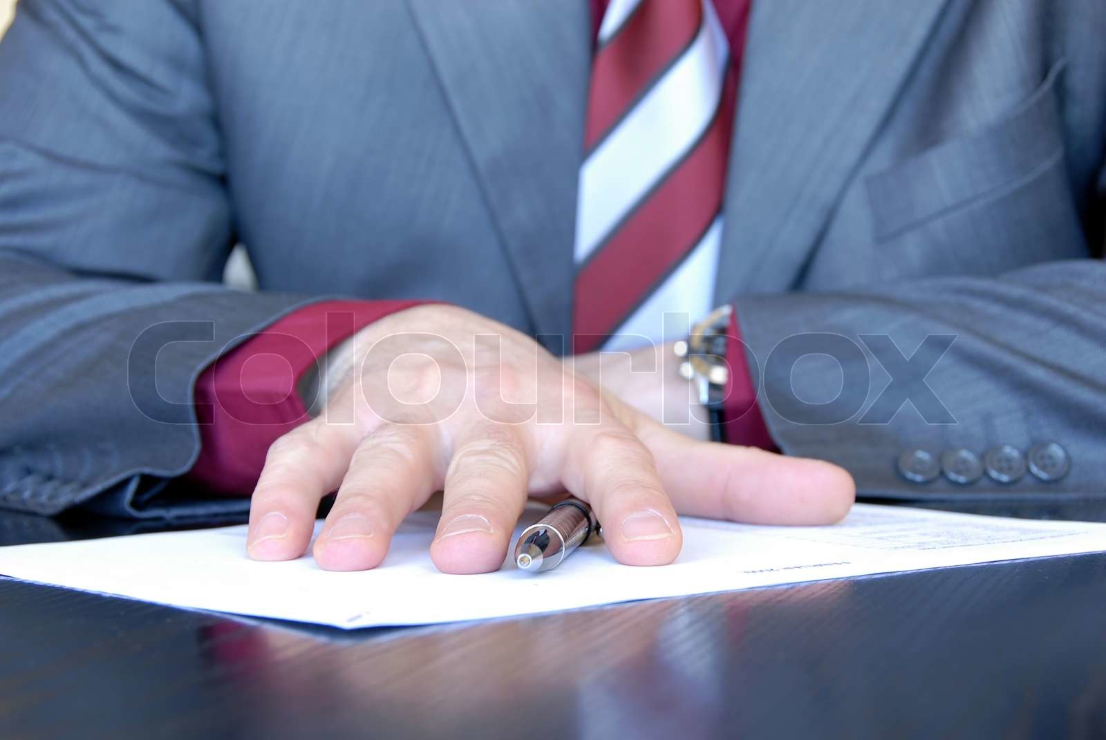 Signing hand | Stock image | Colourbox