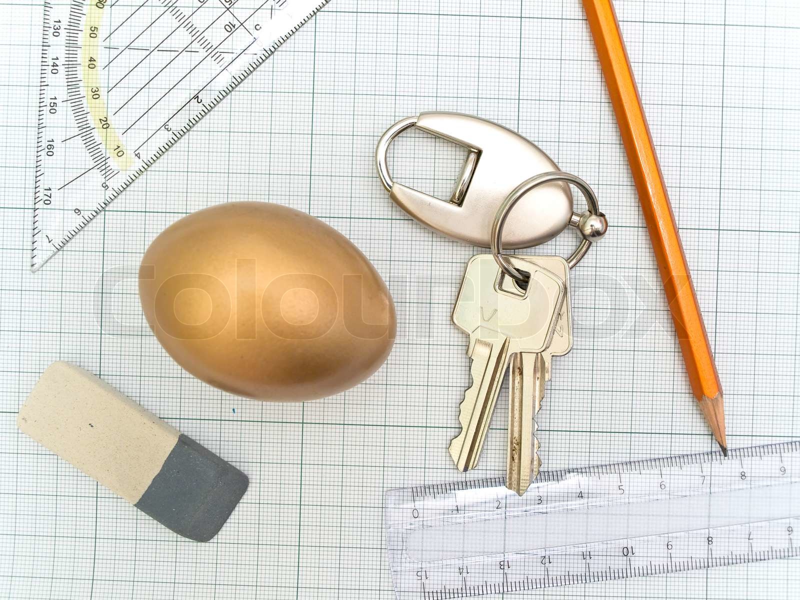 plotting paper with working tools eraser, ruler, pencil, key and golden ...