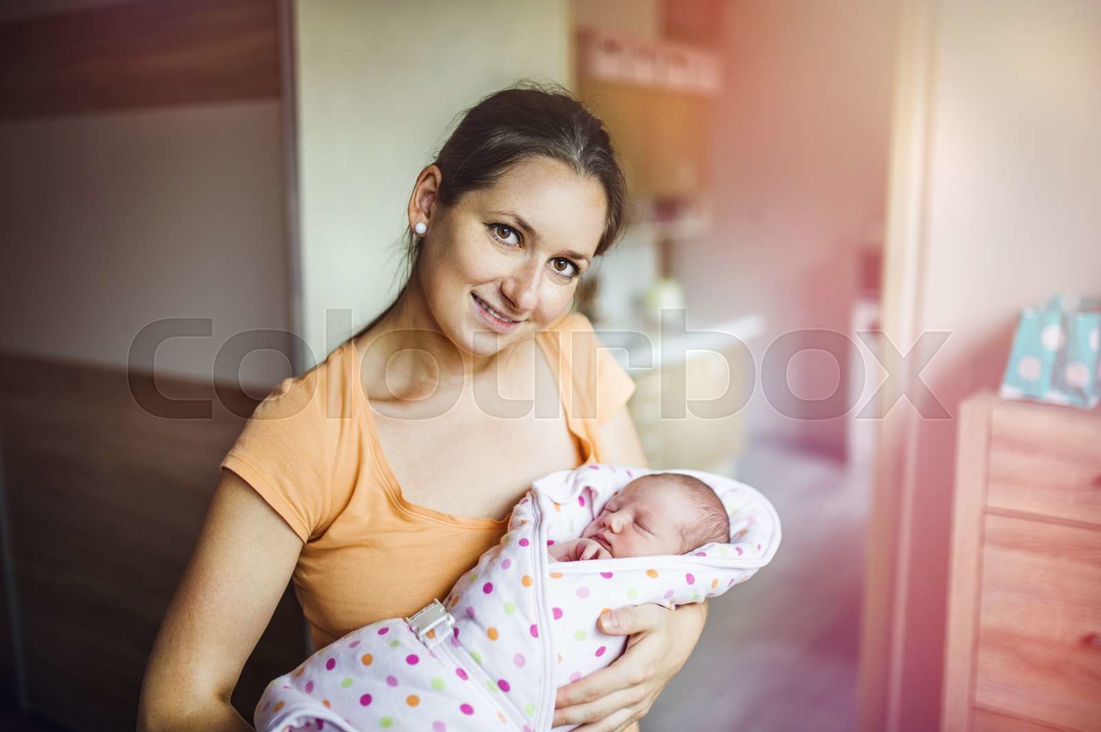 Mother with baby at home | Stock image | Colourbox