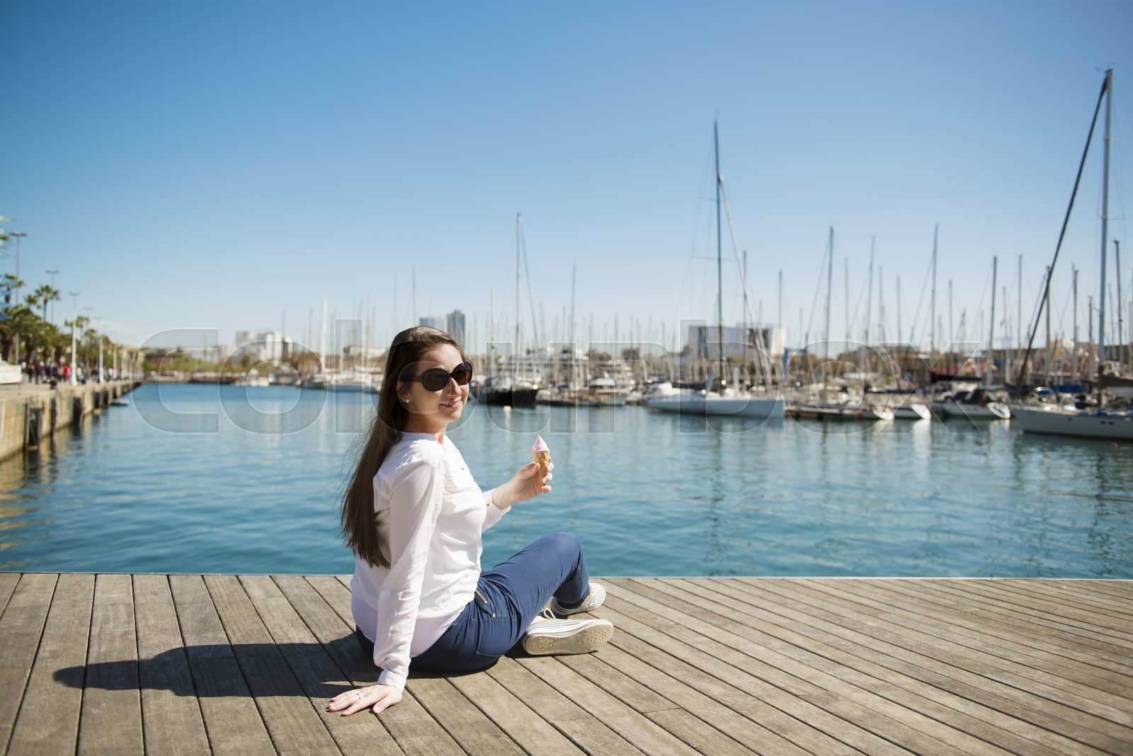 Woman on pier | Stock image | Colourbox
