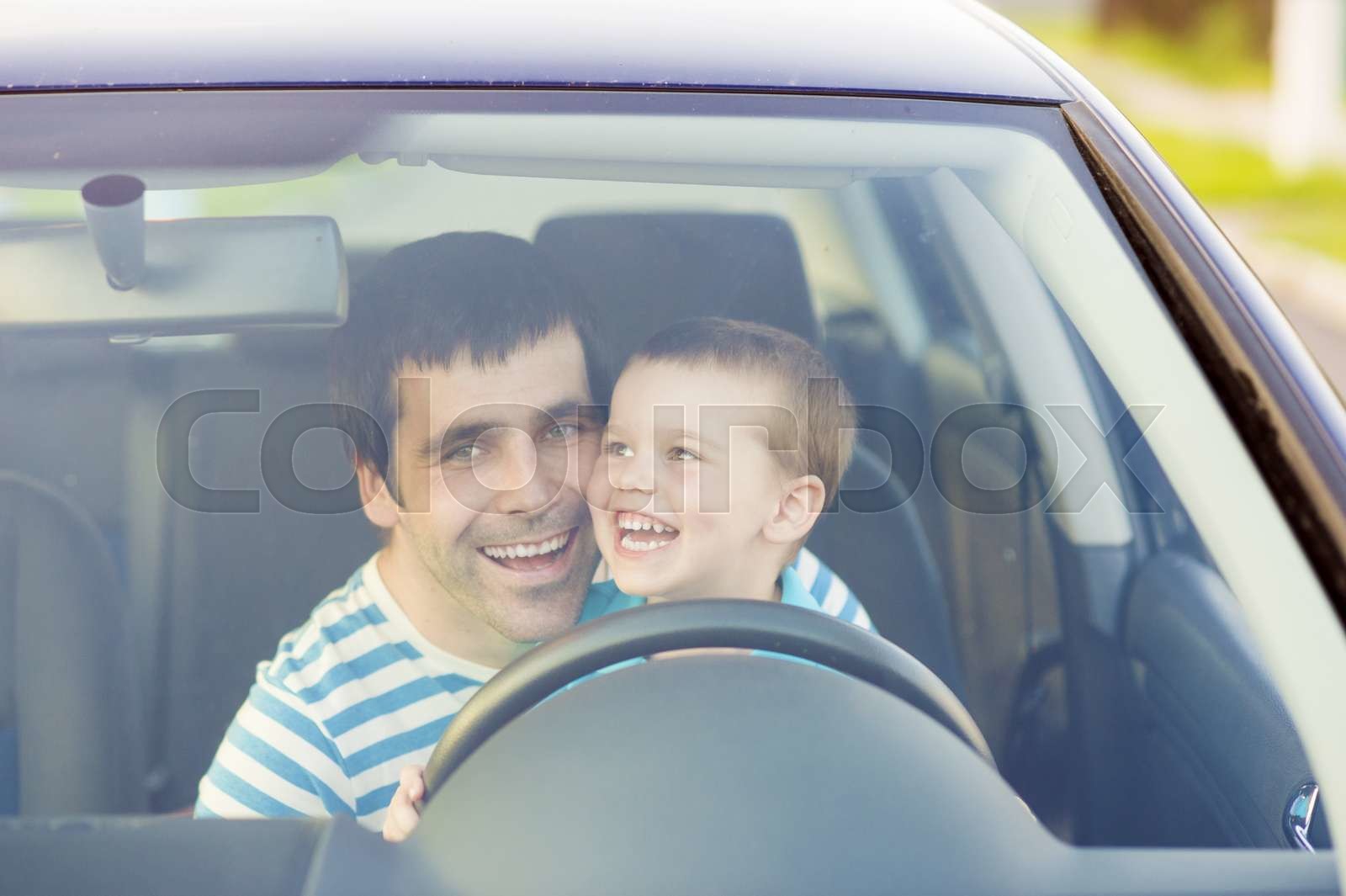 Father and son driving car | Stock image | Colourbox