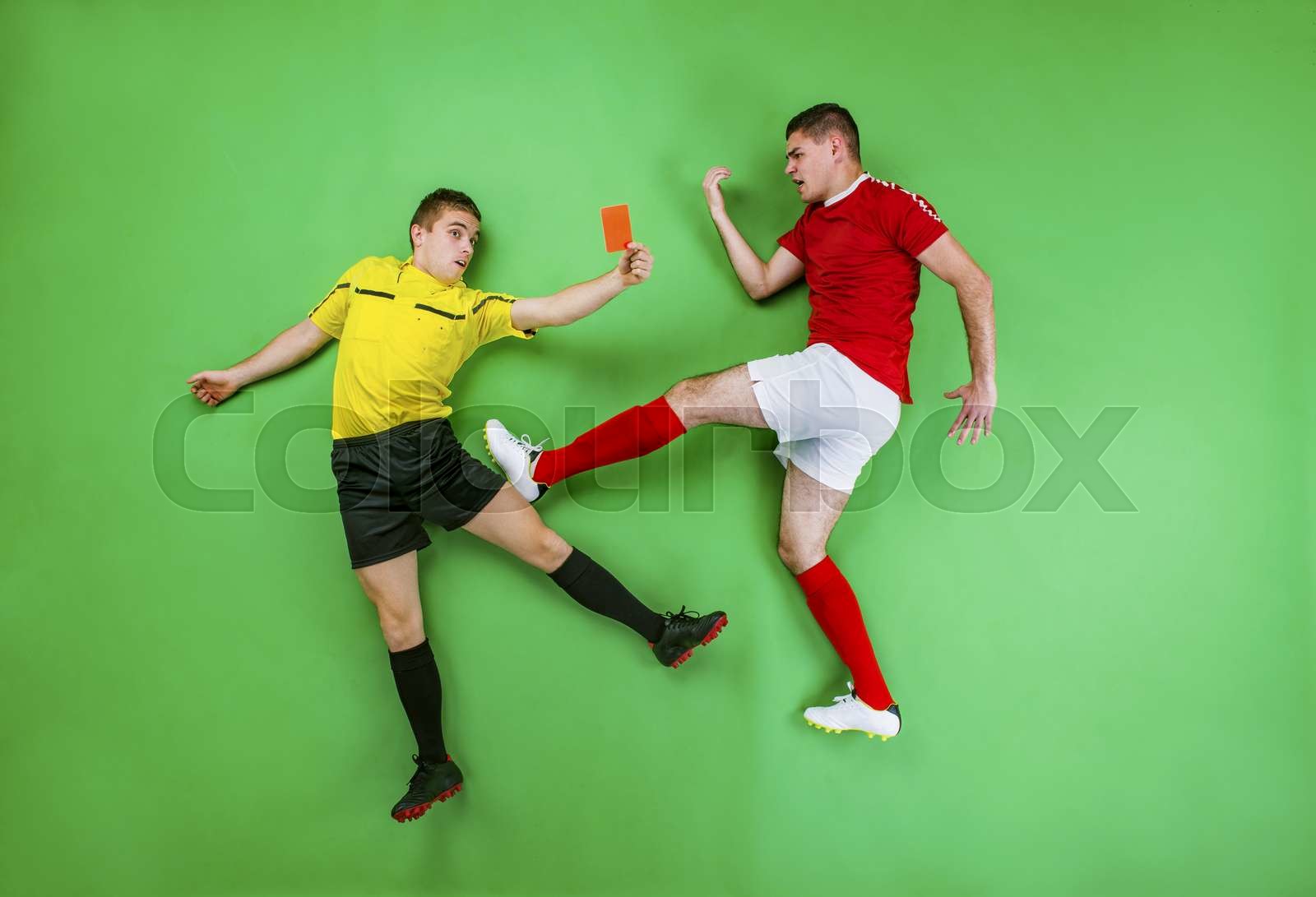 Football player and referee | Stock image | Colourbox