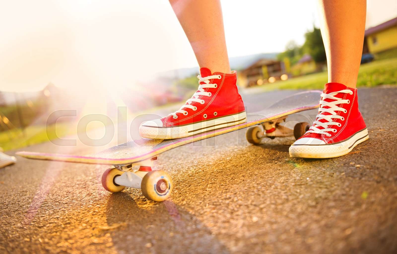 Female feet on skateboard | Stock image | Colourbox