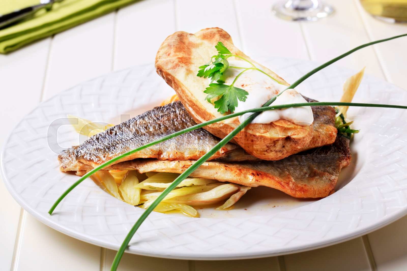 Pan-fried trout fillets with baked potato | Stock image | Colourbox