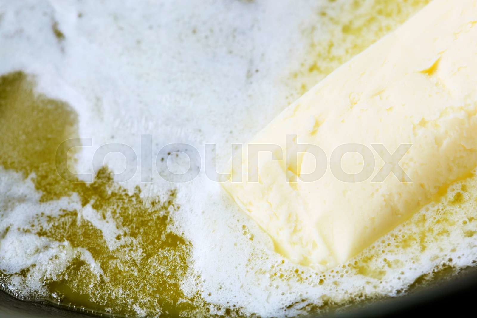Heating butter | Stock image | Colourbox