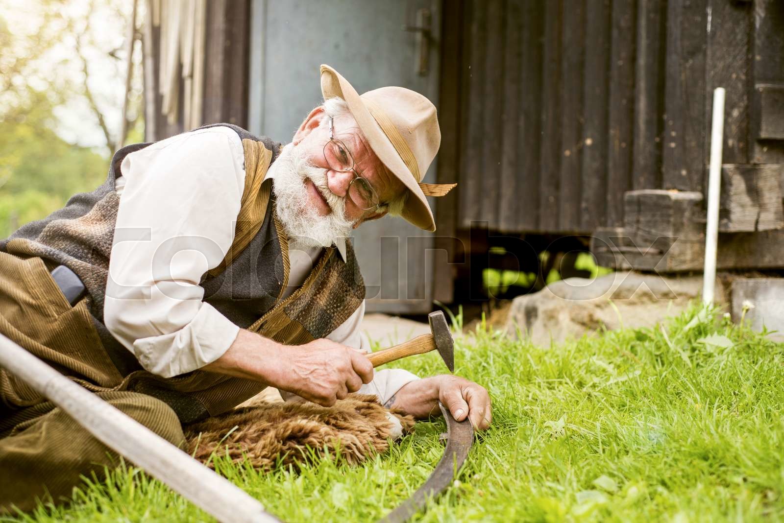 Man with scythe | Stock image | Colourbox