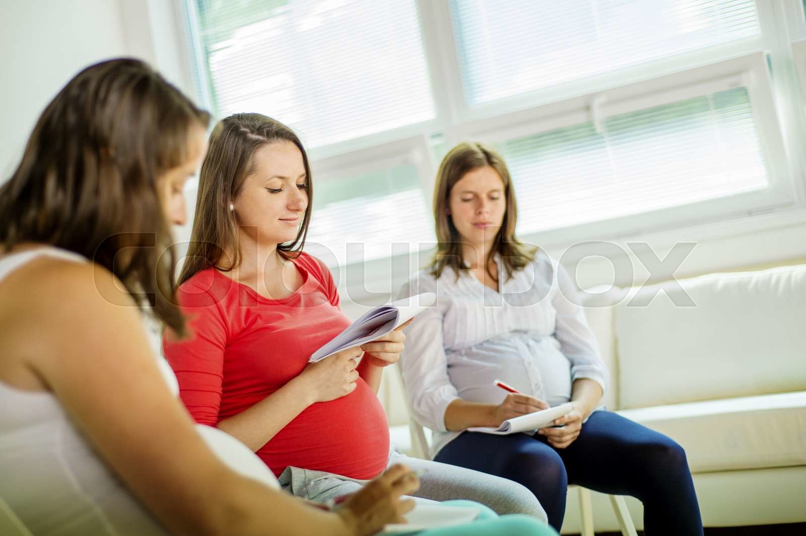 Pregnant women at antenatal class | Stock image | Colourbox
