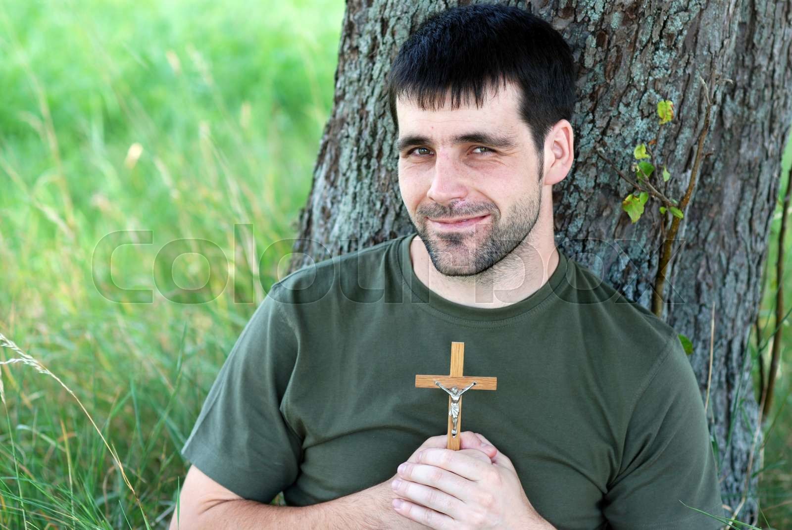 Man with cross | Stock image | Colourbox