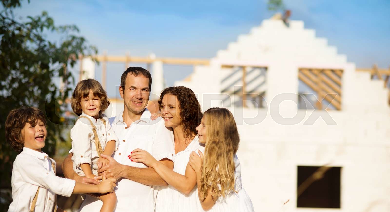 Family building a new house | Stock image | Colourbox