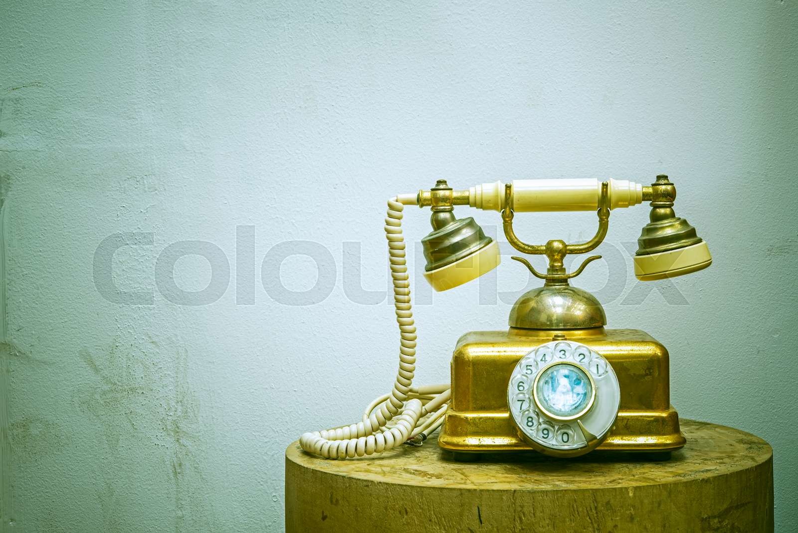 Vintage telephone on retro background | Stock image | Colourbox