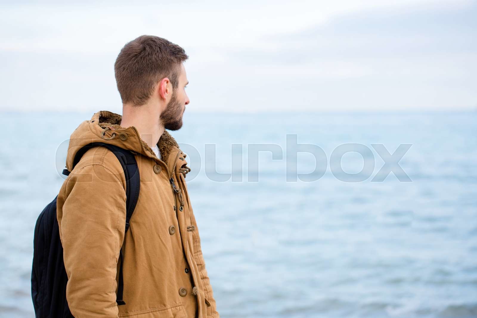Man looking at the sea outdoors | Stock image | Colourbox