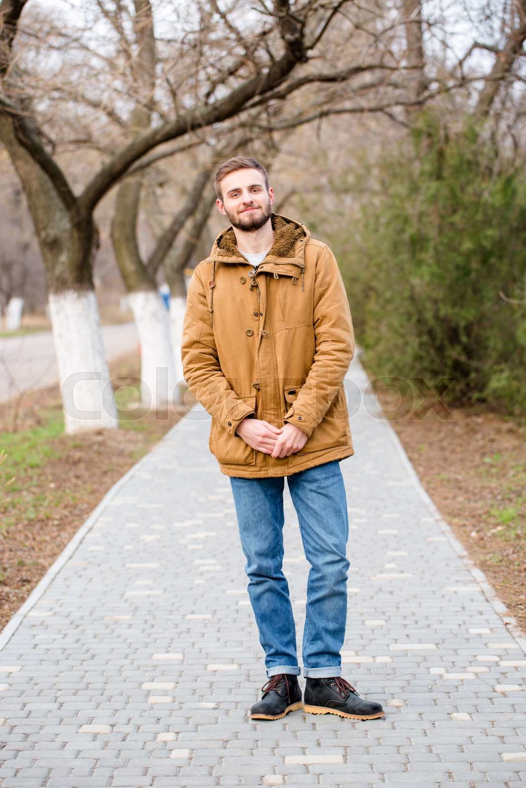 Young man standing outdoors | Stock image | Colourbox
