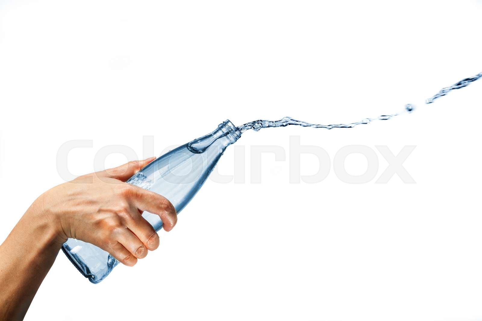 Hand splashing drinking water from glass bottle | Stock image | Colourbox