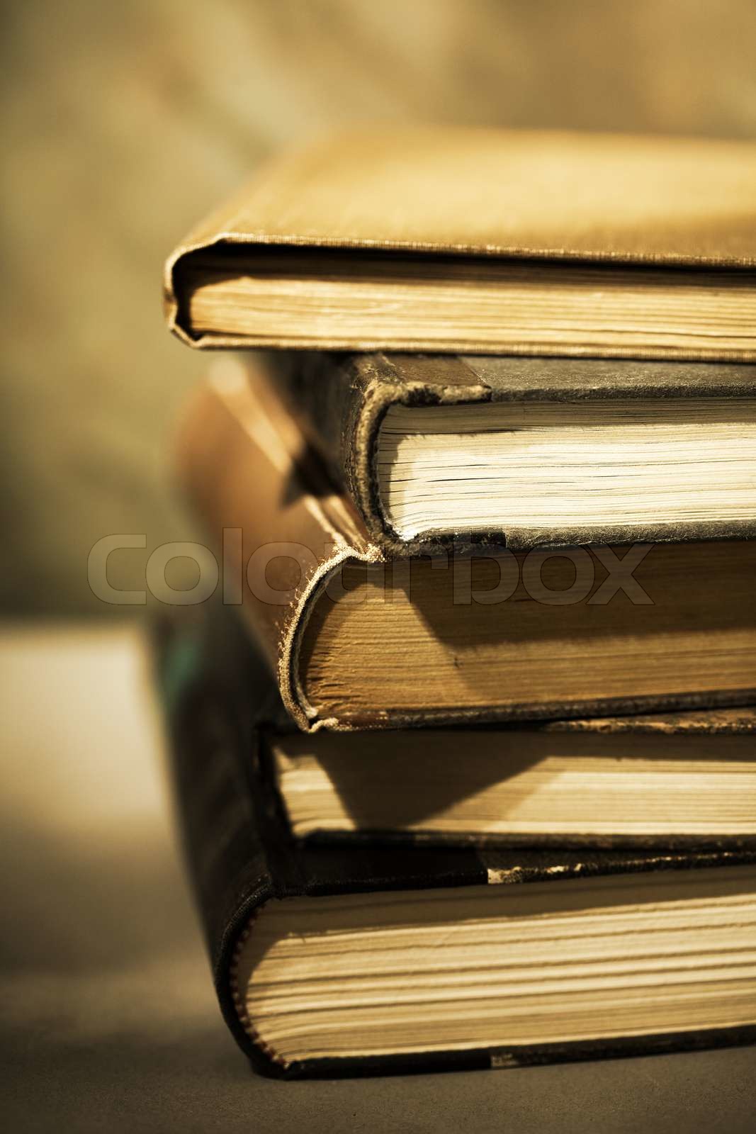 Sepia toned image of stacked books. | Stock image | Colourbox