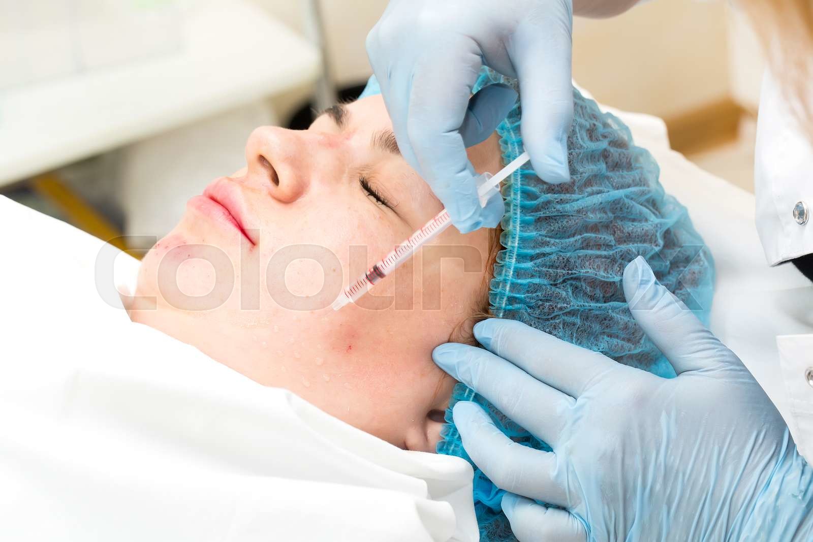 Cosmetic treatment with injection in a clinic | Stock image | Colourbox