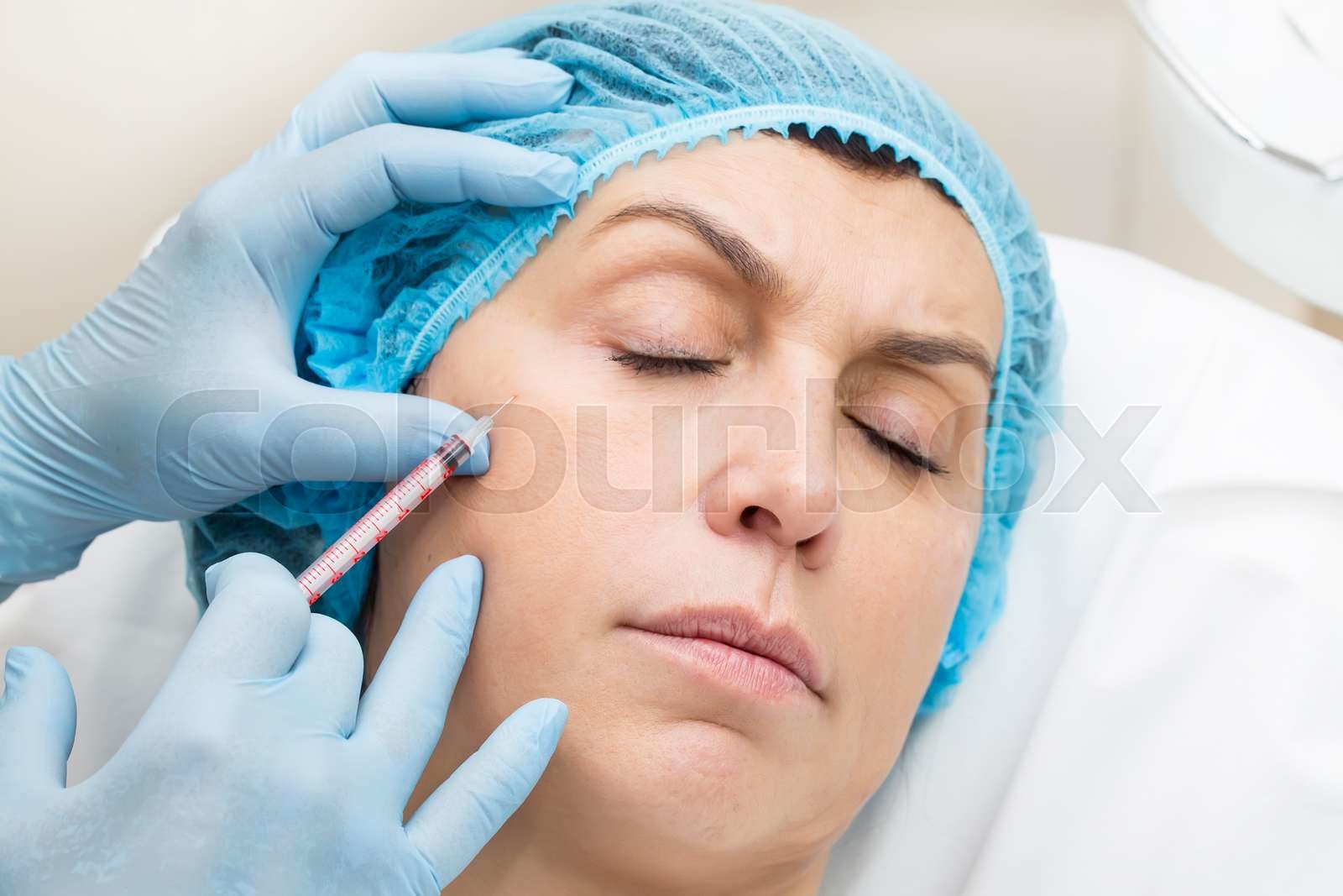 Cosmetic treatment with injection in a clinic | Stock image | Colourbox