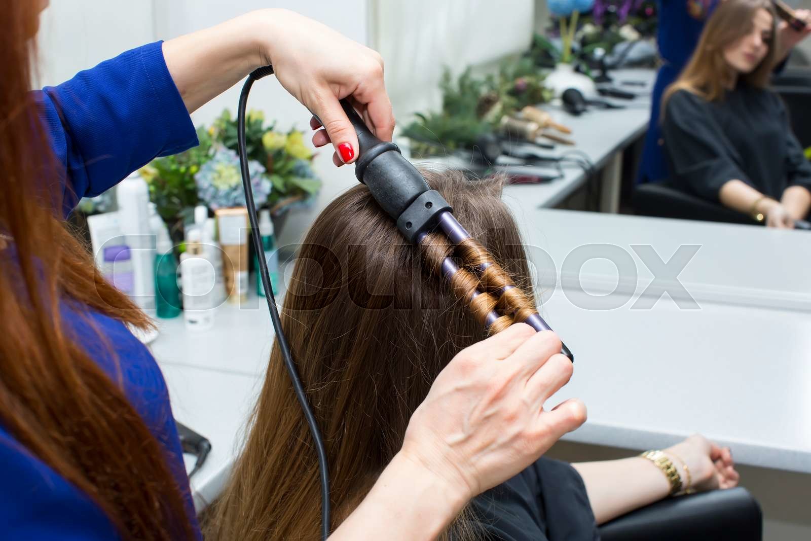 woman in a beauty salon doing hair | Stock image | Colourbox