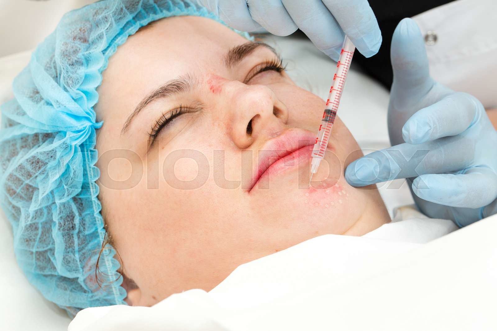 Cosmetic treatment with injection in a clinic | Stock image | Colourbox