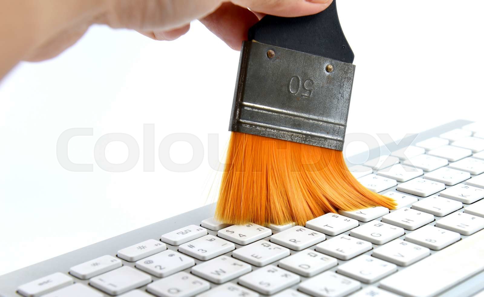 brush the keyboard for cleaning | Stock image | Colourbox