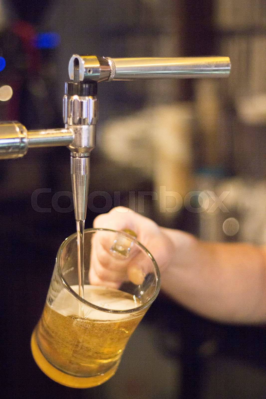 Lager draft beer pump in pub bar | Stock image | Colourbox