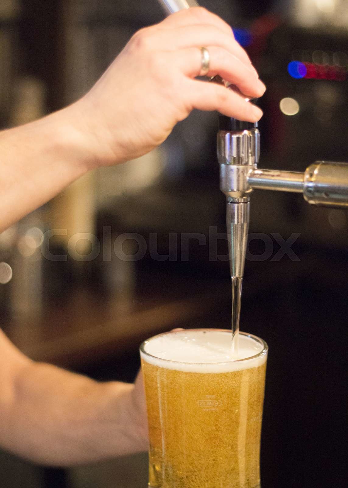 Lager draft beer pump in pub bar | Stock image | Colourbox
