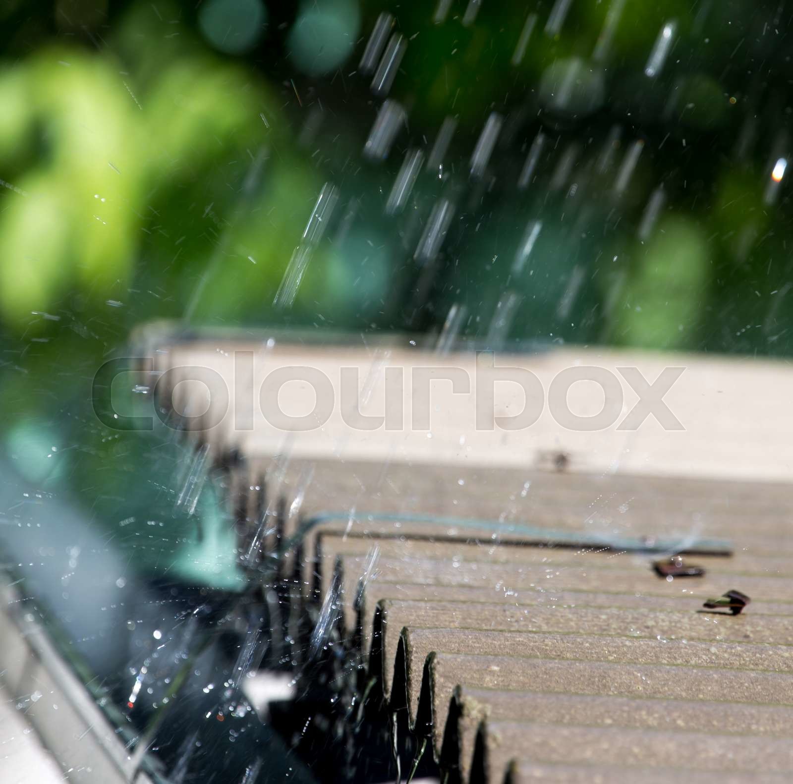 storm rain on the roof of the house | Stock image | Colourbox