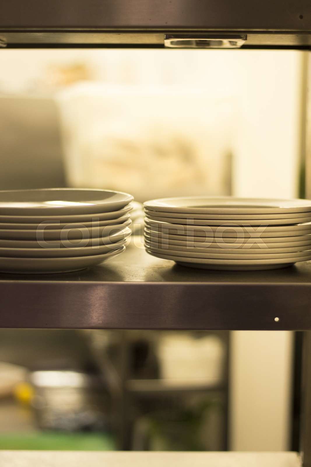 Plates in restaurant cafe kitchen | Stock image | Colourbox