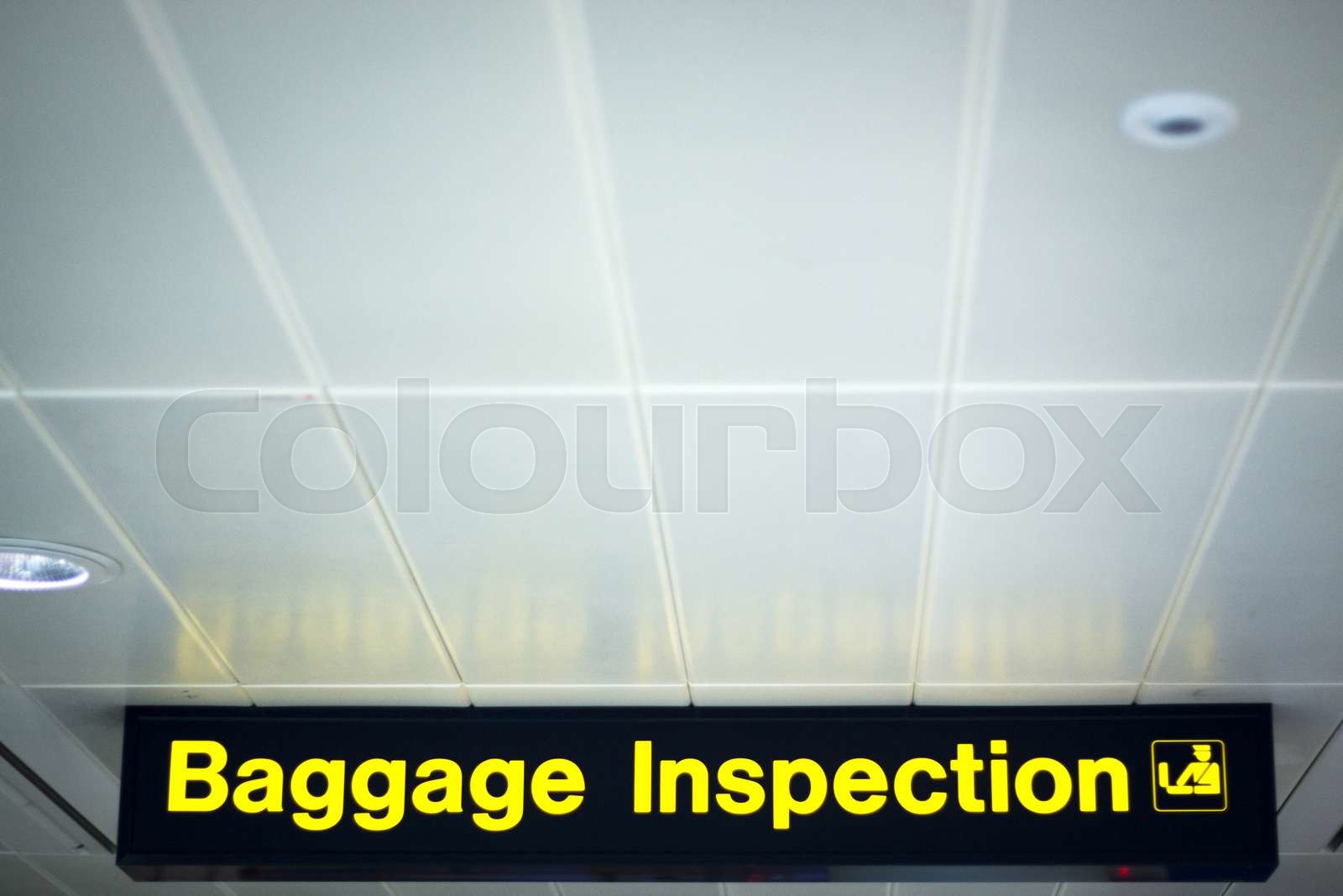 Airport baggage inspection sign | Stock image | Colourbox