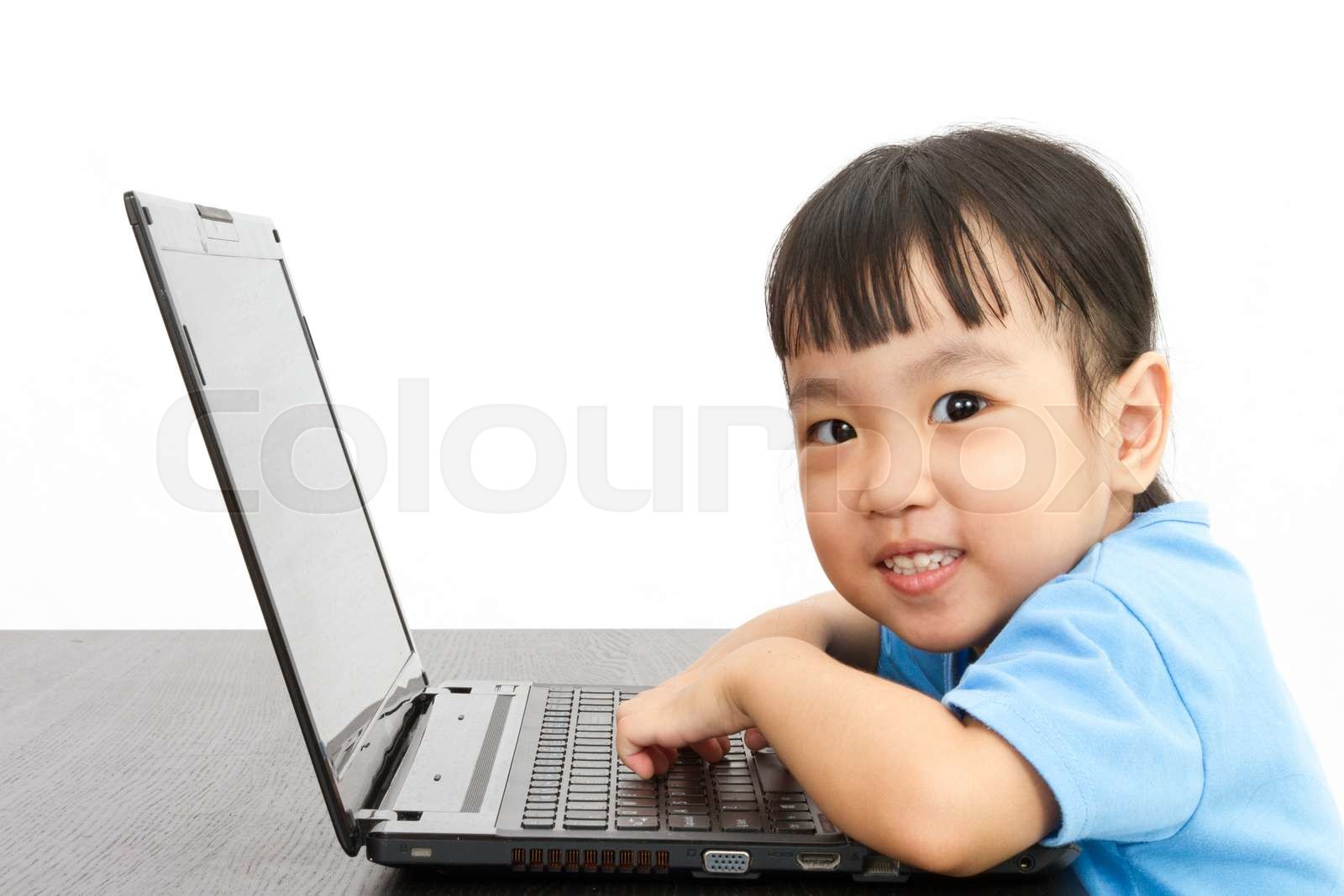 Chinese little girl using laptop | Stock image | Colourbox