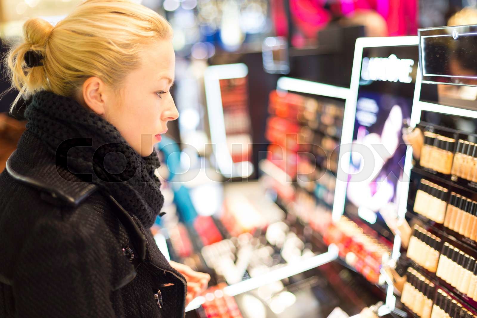 Beautiful woman shopping in beauty store. | Stock image | Colourbox