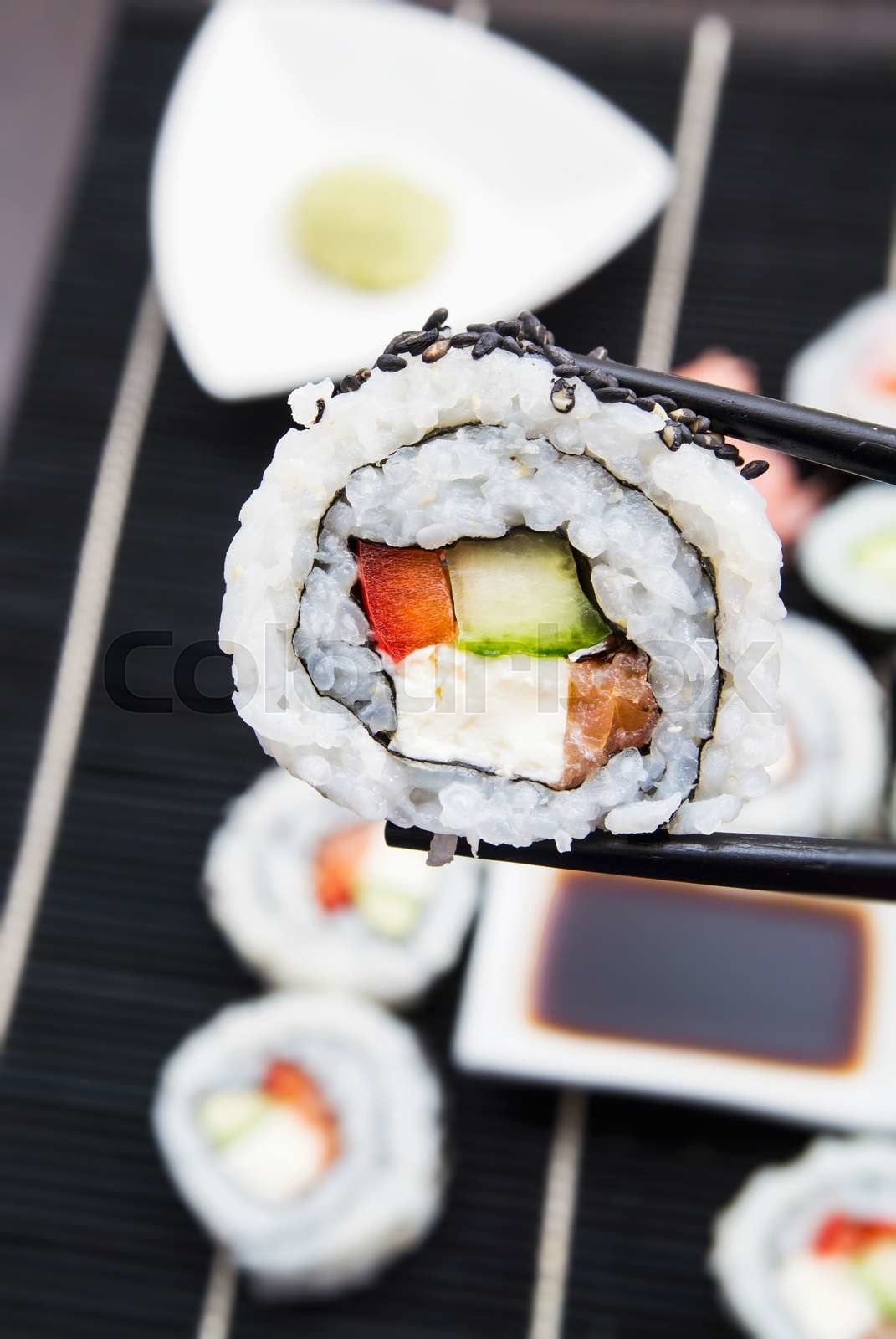 Sushi and sticks. Closeup composition | Stock image | Colourbox