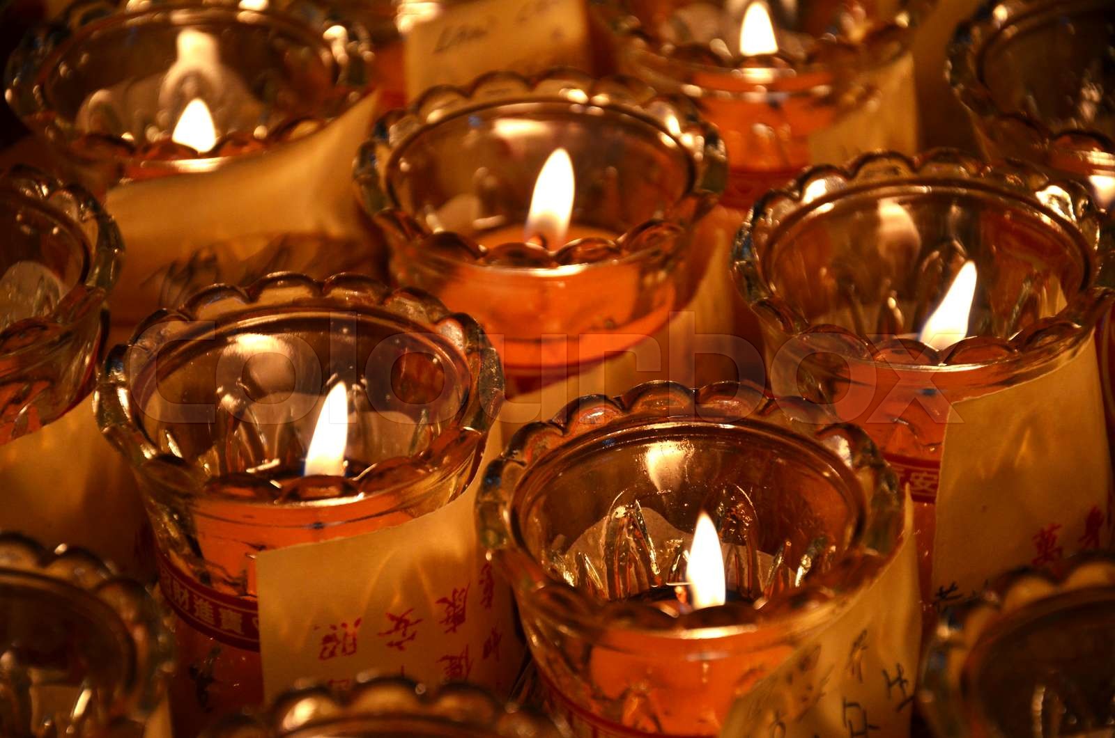 Temple candles in transparent chandeliers | Stock image | Colourbox