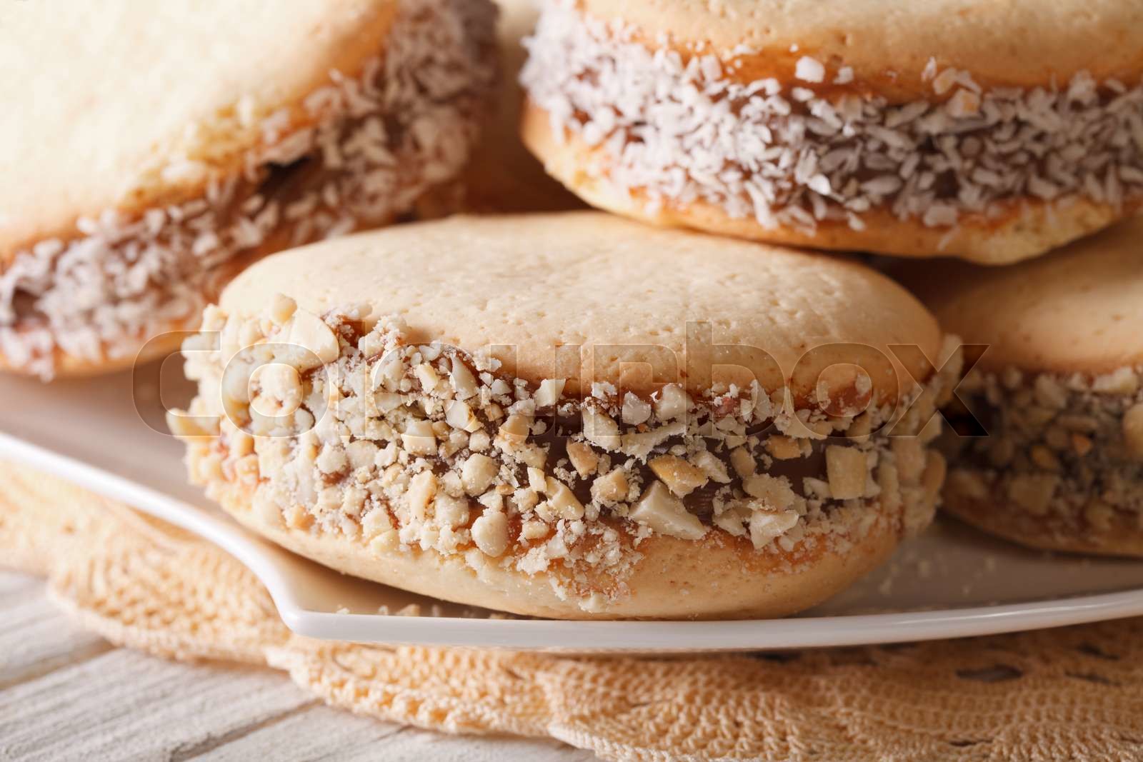 Argentine sweets: cookies alfajores macro on a plate. horizontal ...