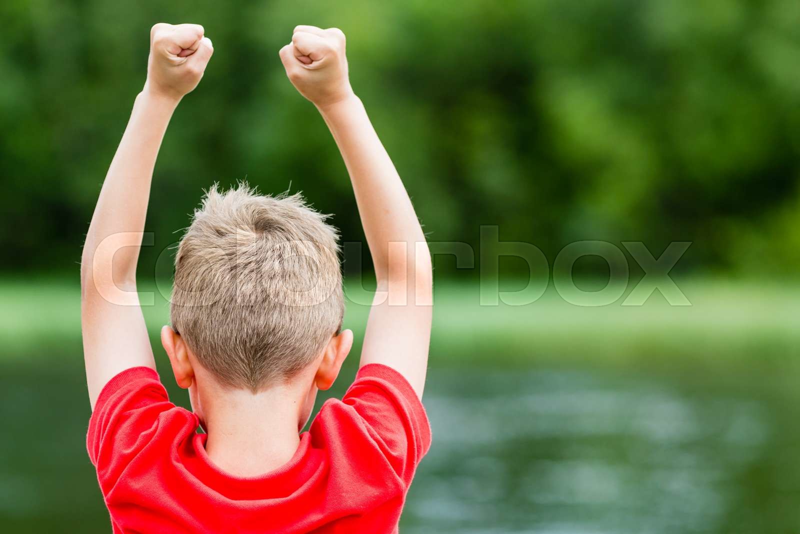 Child celebrating success or victory | Stock image | Colourbox