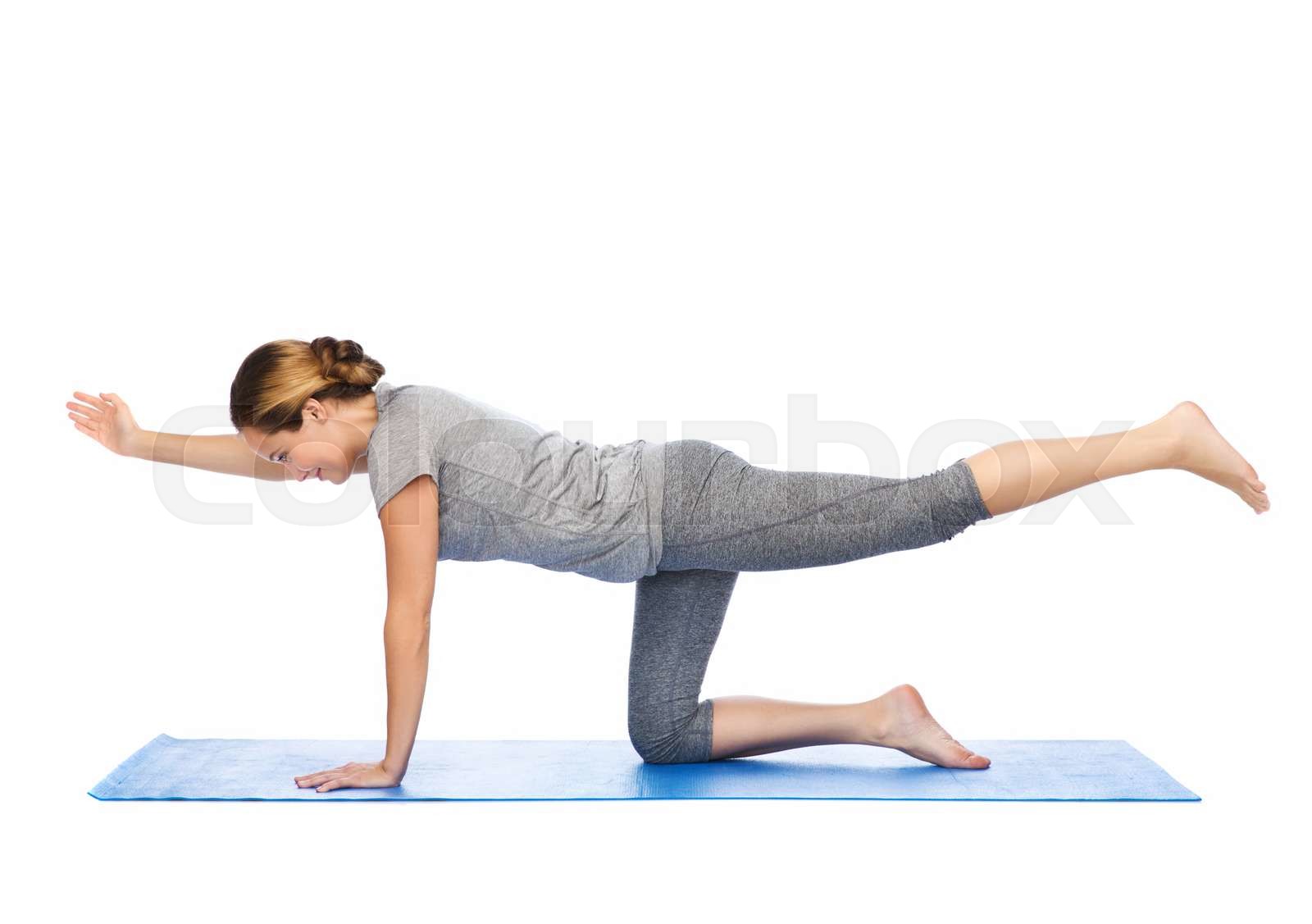 woman making yoga in balancing table pose on mat | Stock image | Colourbox
