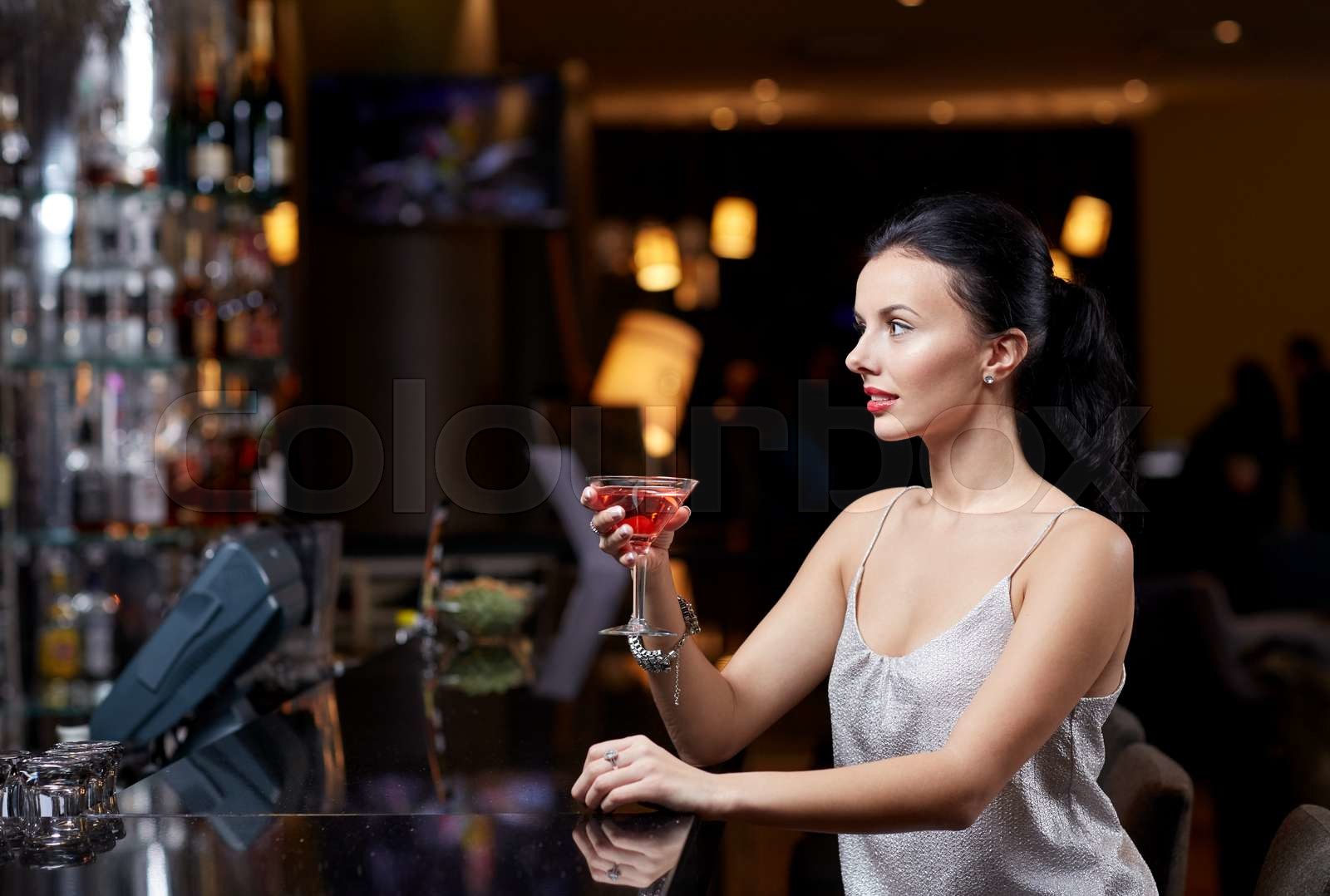 glamorous woman with cocktail at night club or bar | Stock image ...