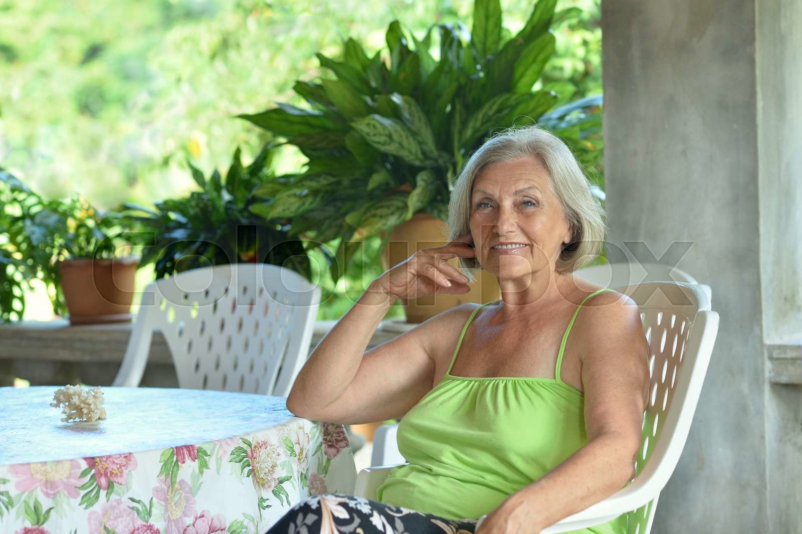 Older Woman Resting At Tropical Resort Stock Image Colourbox