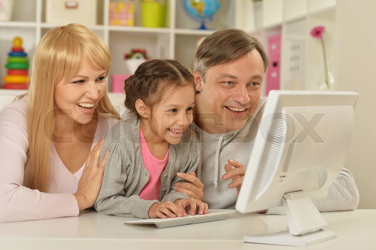 happy family playing on computer | Stock image | Colourbox