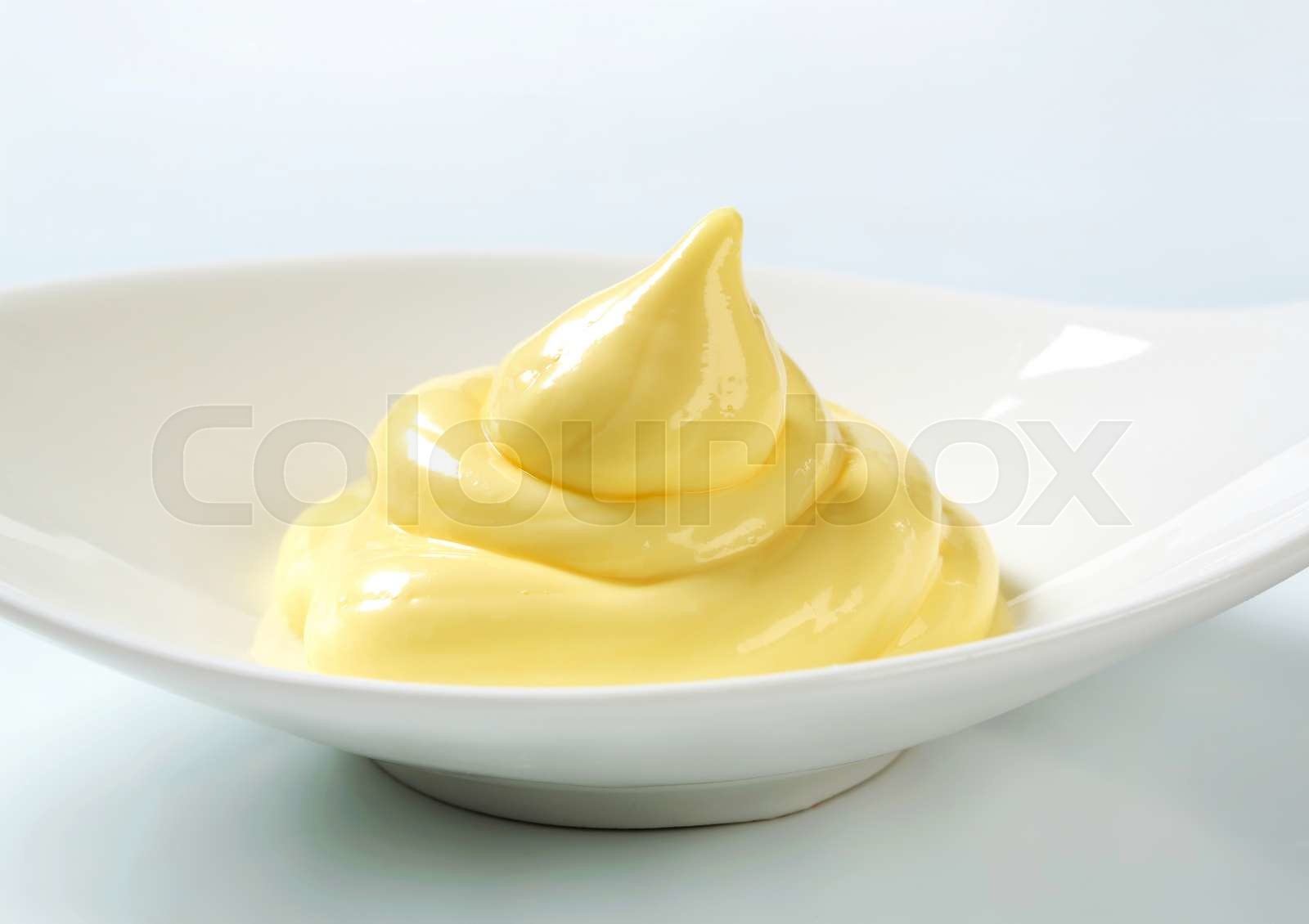 Plate of vanilla pastry cream | Stock image | Colourbox
