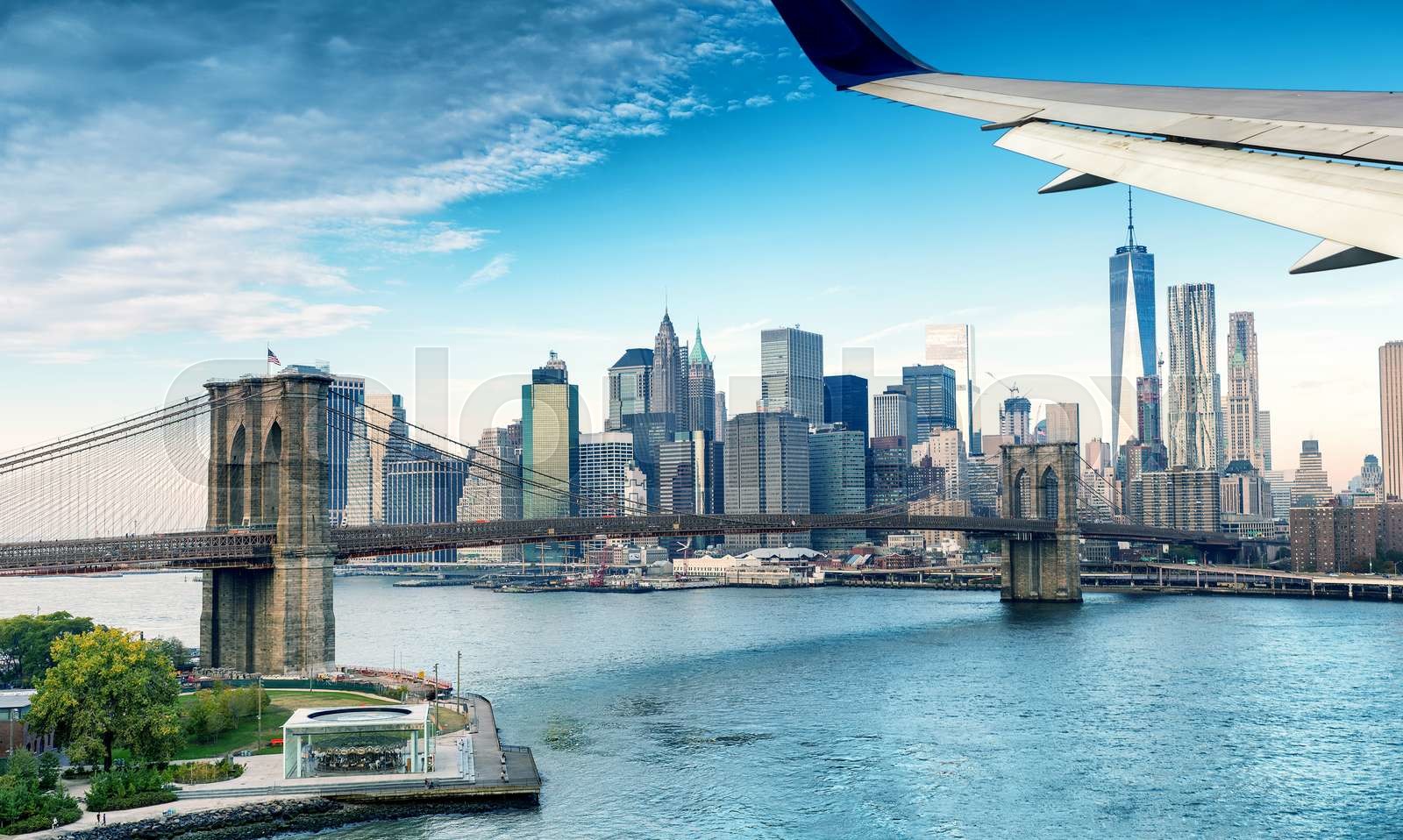 Airplane wing over New York City skyline | Stock image | Colourbox