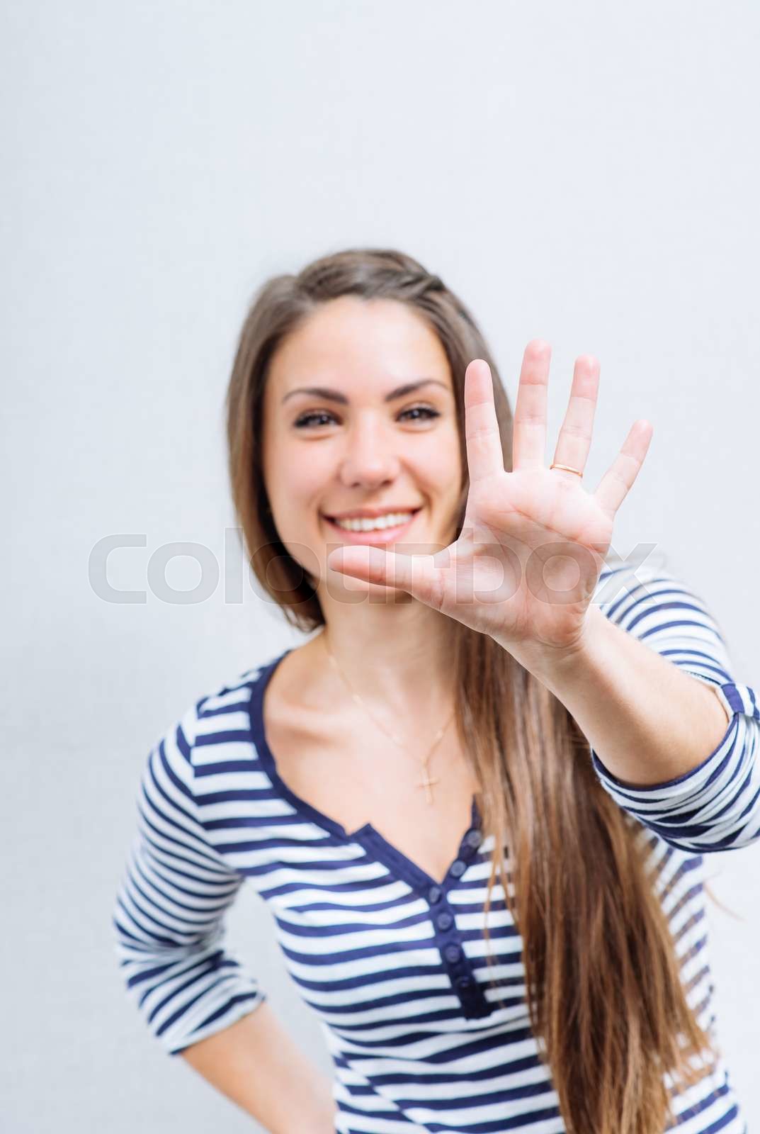 pretty girl waving | Stock image | Colourbox